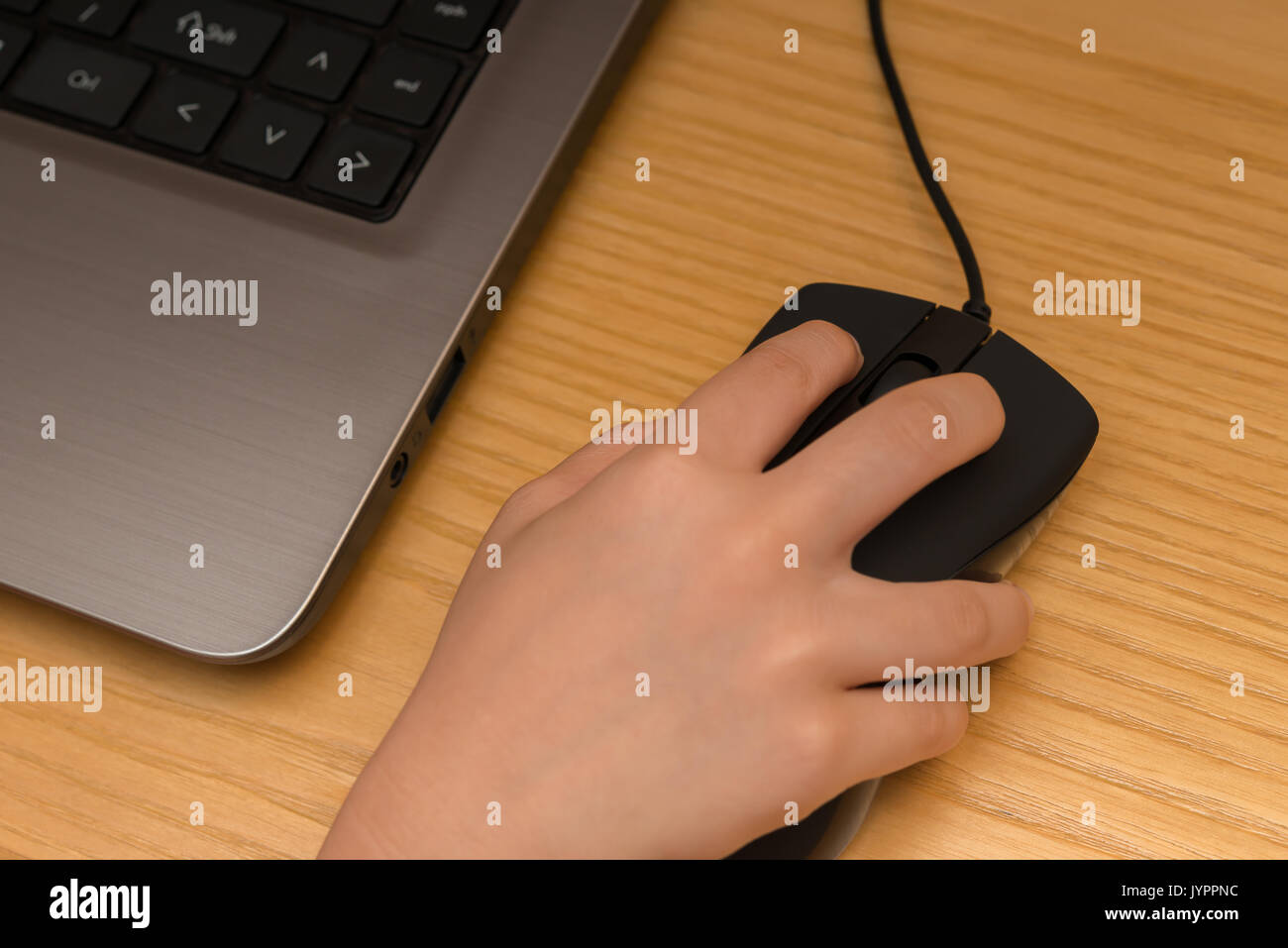kid using a laptop with mouse Stock Photo - Alamy