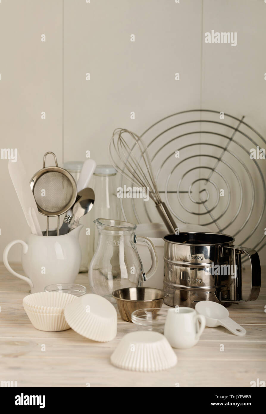 Kitchen tools of white and steel color (accessories) for baking on a ...