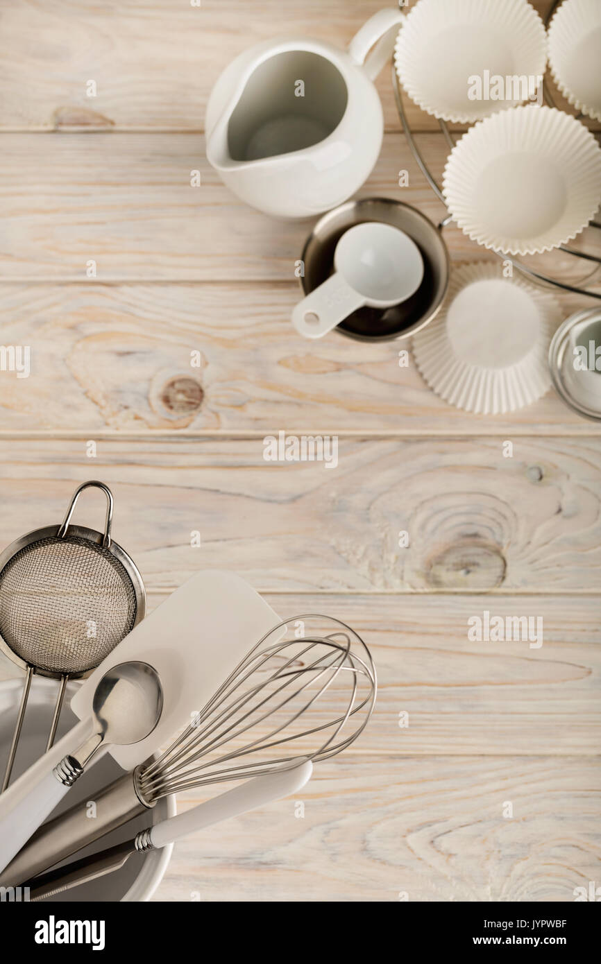 Kitchen tools of white and steel color (accessories) for baking on a ...