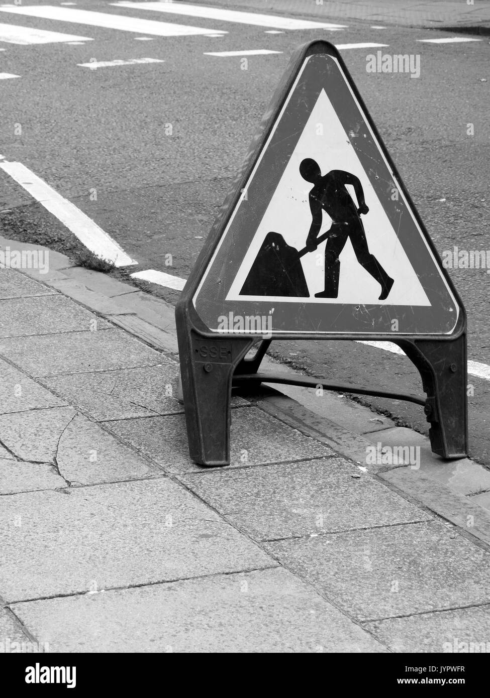 Highway roadworks sign on approach to zebra crossing Stock Photo - Alamy