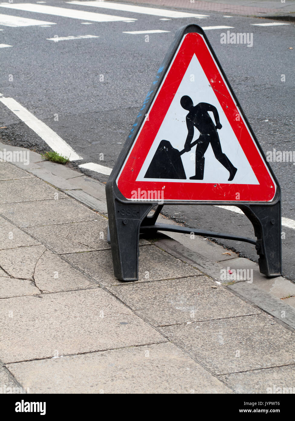 Highway roadworks sign on approach to zebra crossing Stock Photo - Alamy