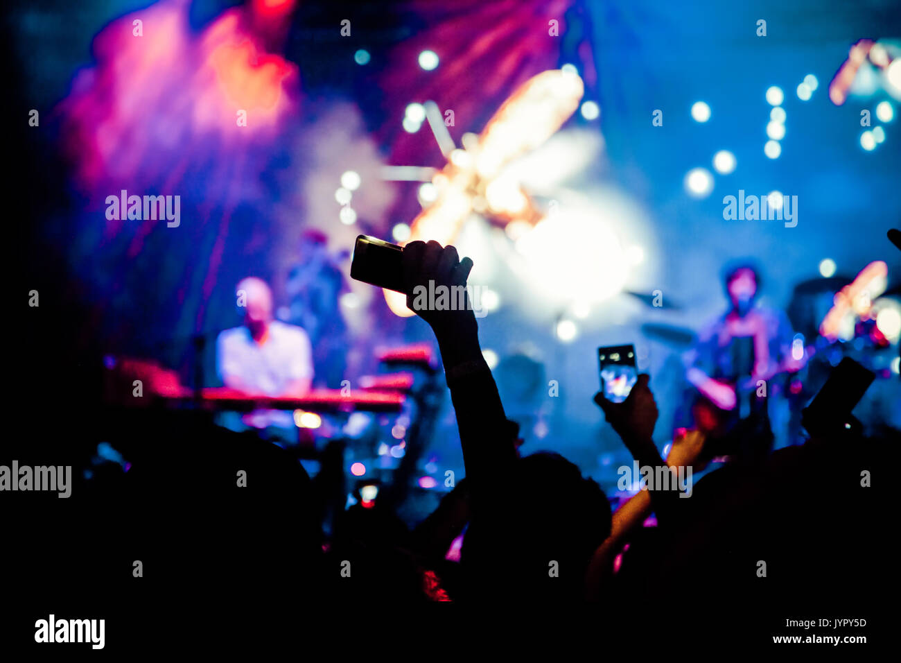 crowd with raised hands at concert - summer music festival Photo ...