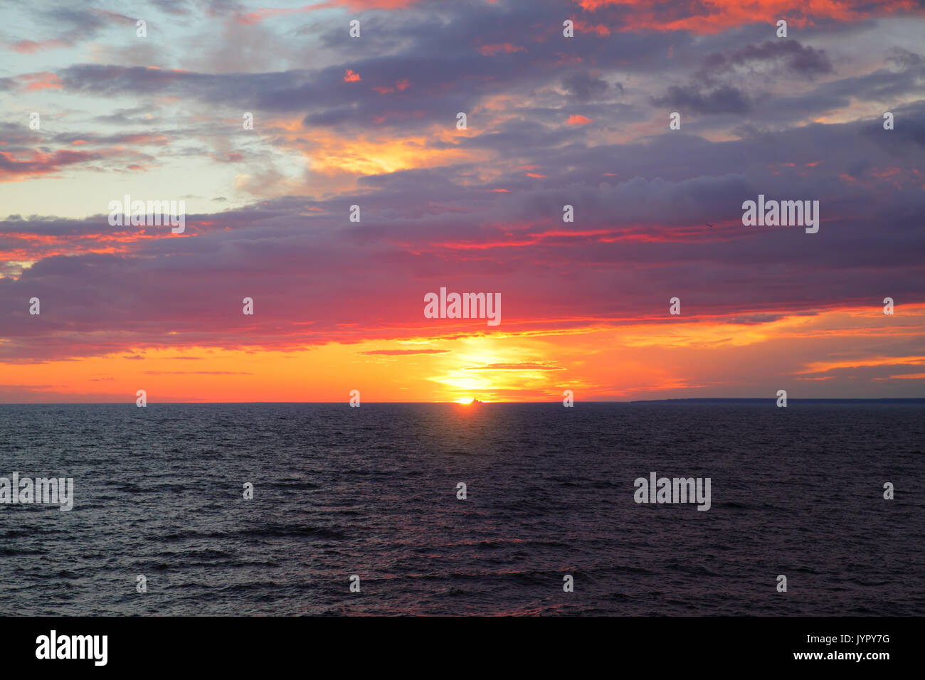 Sundown over sea - scenic sunset seascape with sea horizon and colorful ...