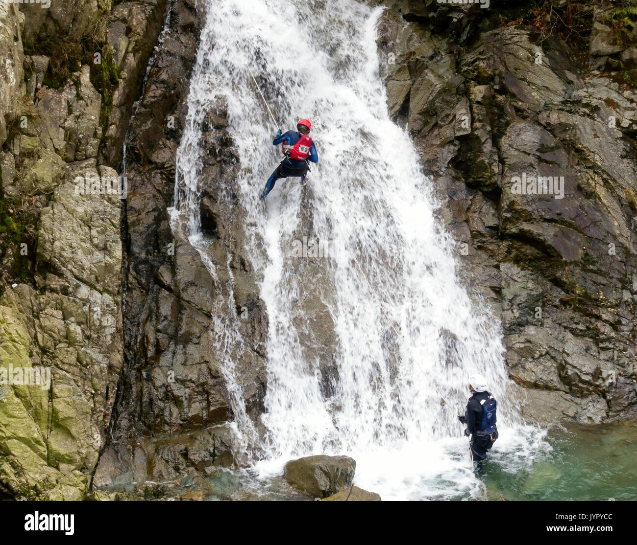 climbing down waterfalls Stock Photo - Alamy