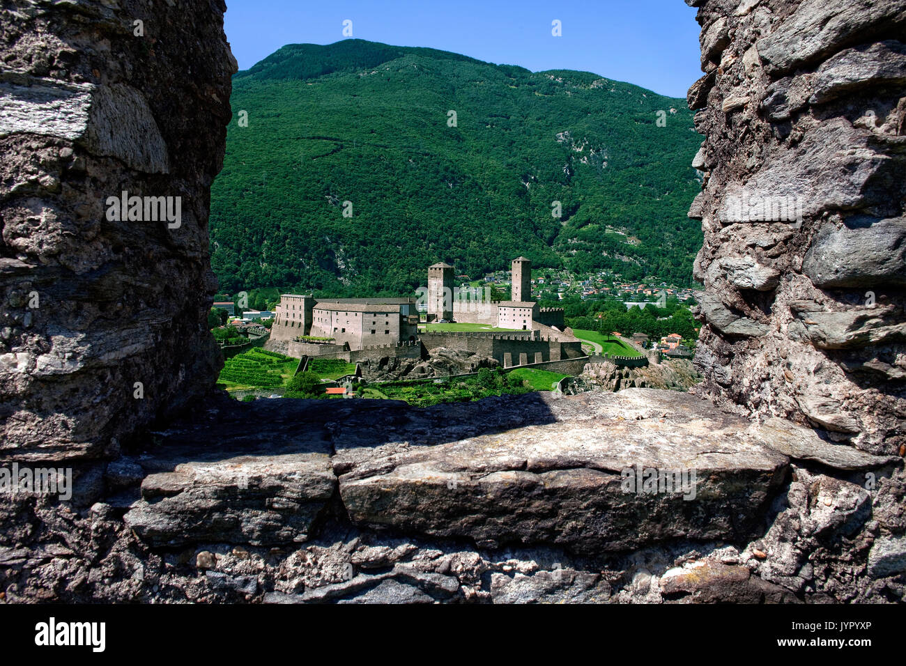Castlegrande framed by ruined stone of Montebello Castle, Three Castles ...