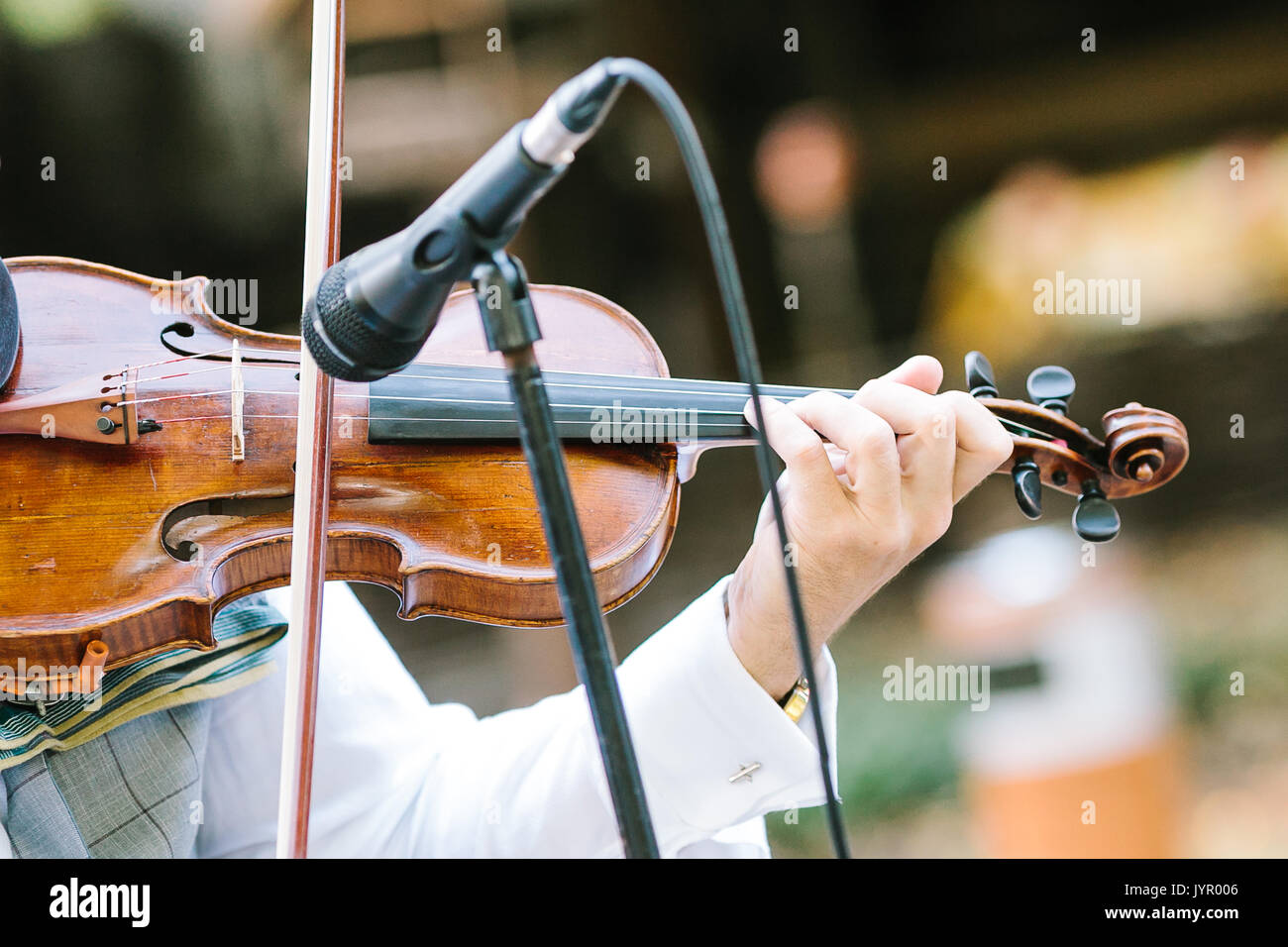 entertainment, music, culture concept. male violinist with beautiful ...