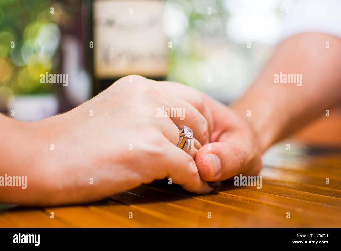 Couple holding hands on a romantic date Stock Photo - Alamy