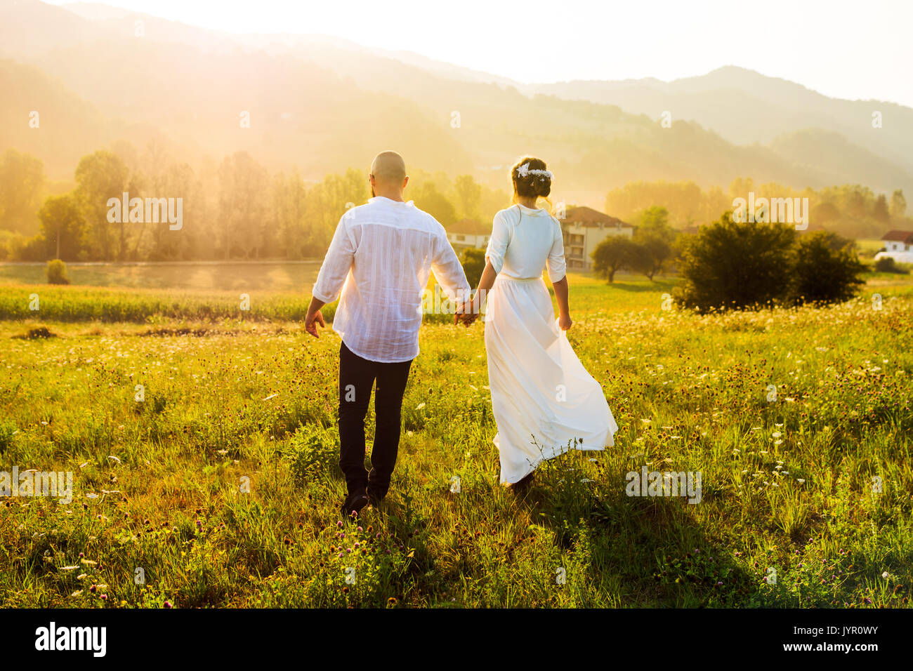 Man walking into sunset hi-res stock photography and images - Alamy