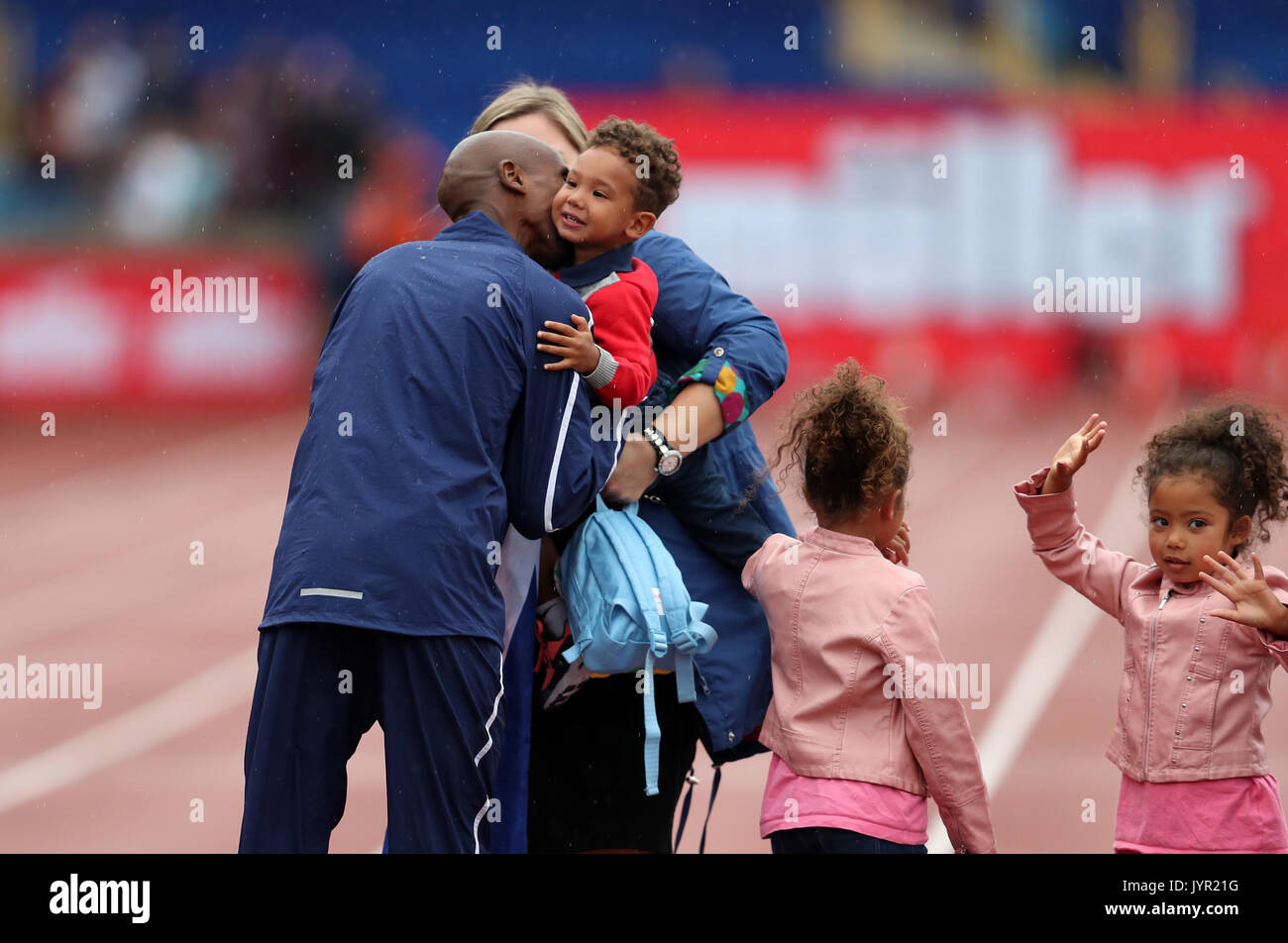 Great Britain's Mo Farah celebrates with his family after winning the ...