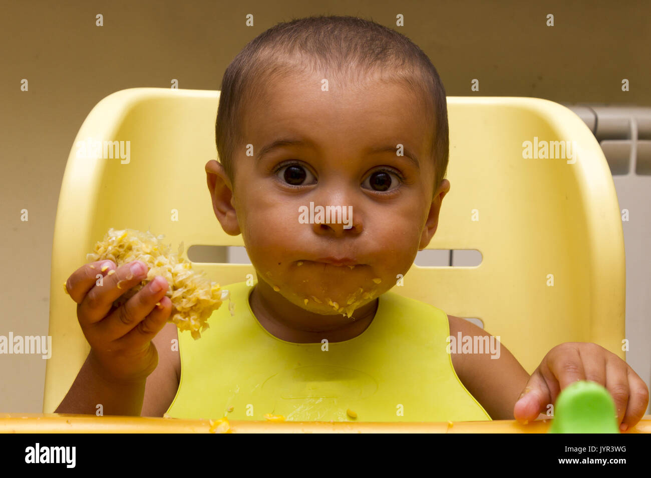 Baby is eating Stock Photo - Alamy