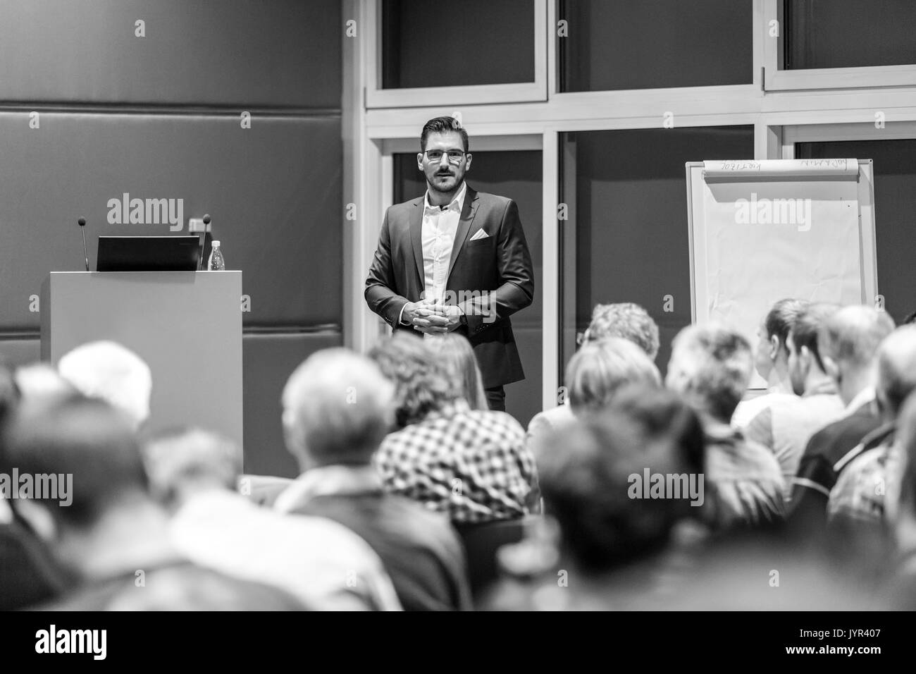 Business speaker giving a talk at conference meeting Stock Photo - Alamy