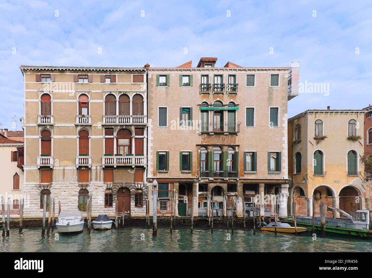 Old Gothic architecture houses in Venice with docked boats Stock Photo ...