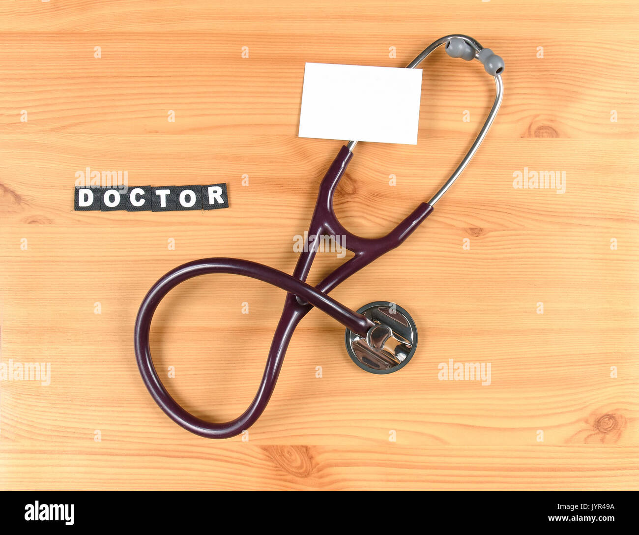 Stethoscope with blank card and doctor letters Stock Photo - Alamy