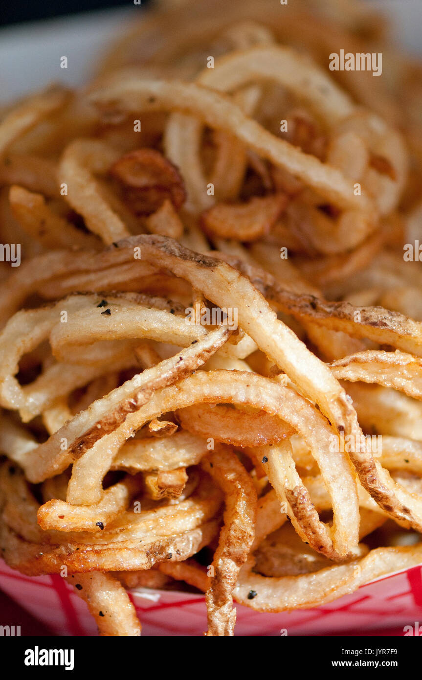 A red and white paper plate filled with hot golden french fries Stock ...