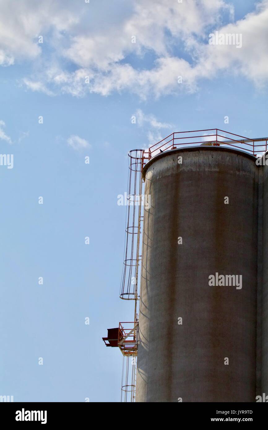 Flour mill grainery against a light blue sky Stock Photo - Alamy