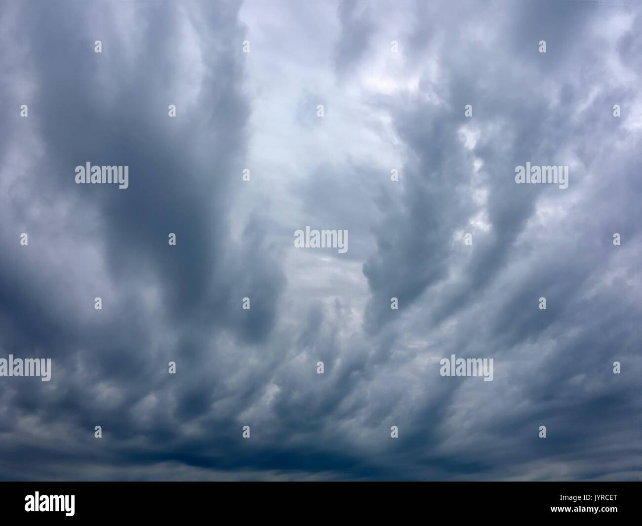 Heavy overcast dark blue and white altocumulus Stock Photo - Alamy