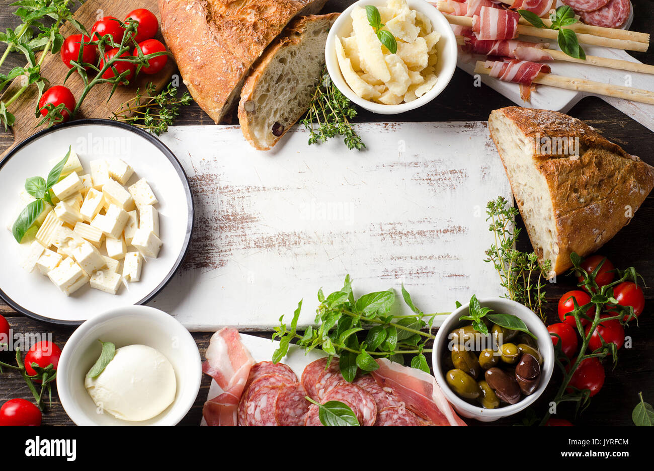 Various types of italian food on wooden board. Top view Stock Photo - Alamy