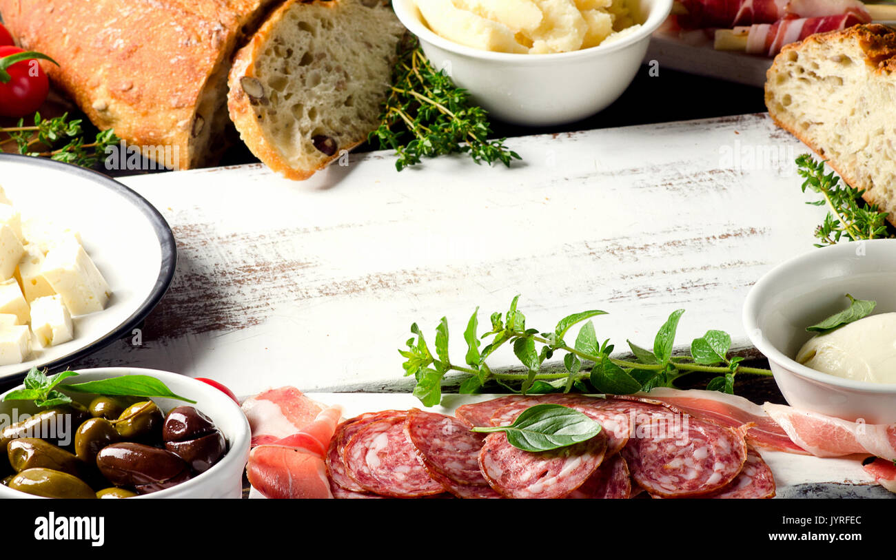 Various types of italian food on a white wooden table Stock Photo - Alamy