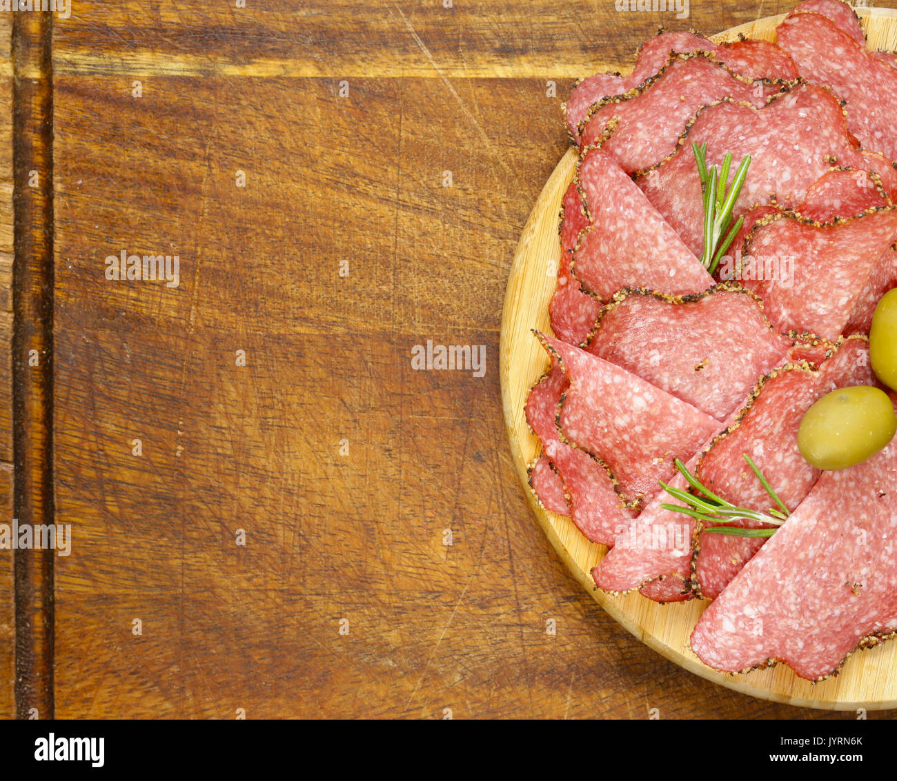 Salami pepperoni with aromatic pepper on a plate Stock Photo - Alamy