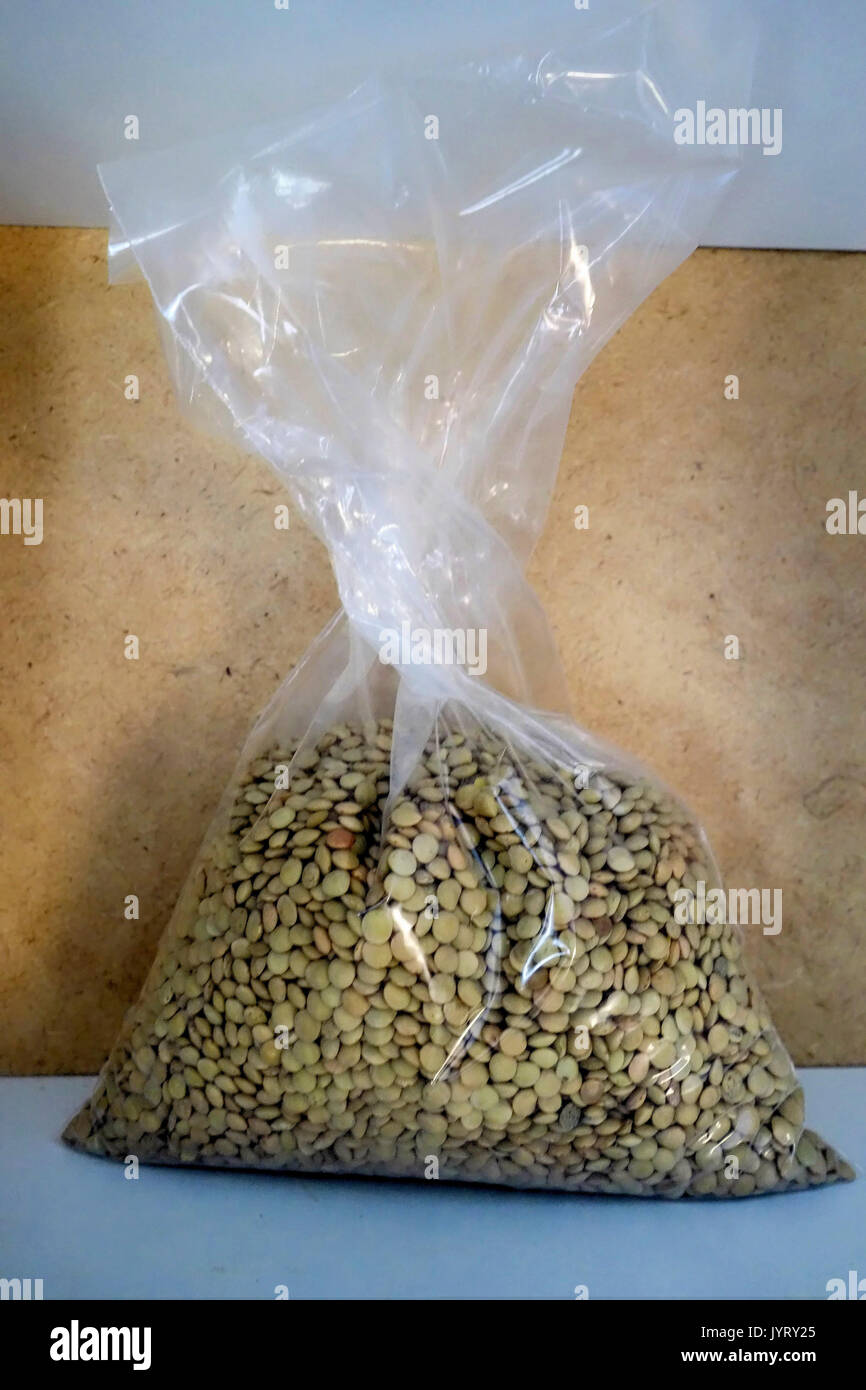 Transparent packet of lentils in Kitchen Cupboard Stock Photo - Alamy