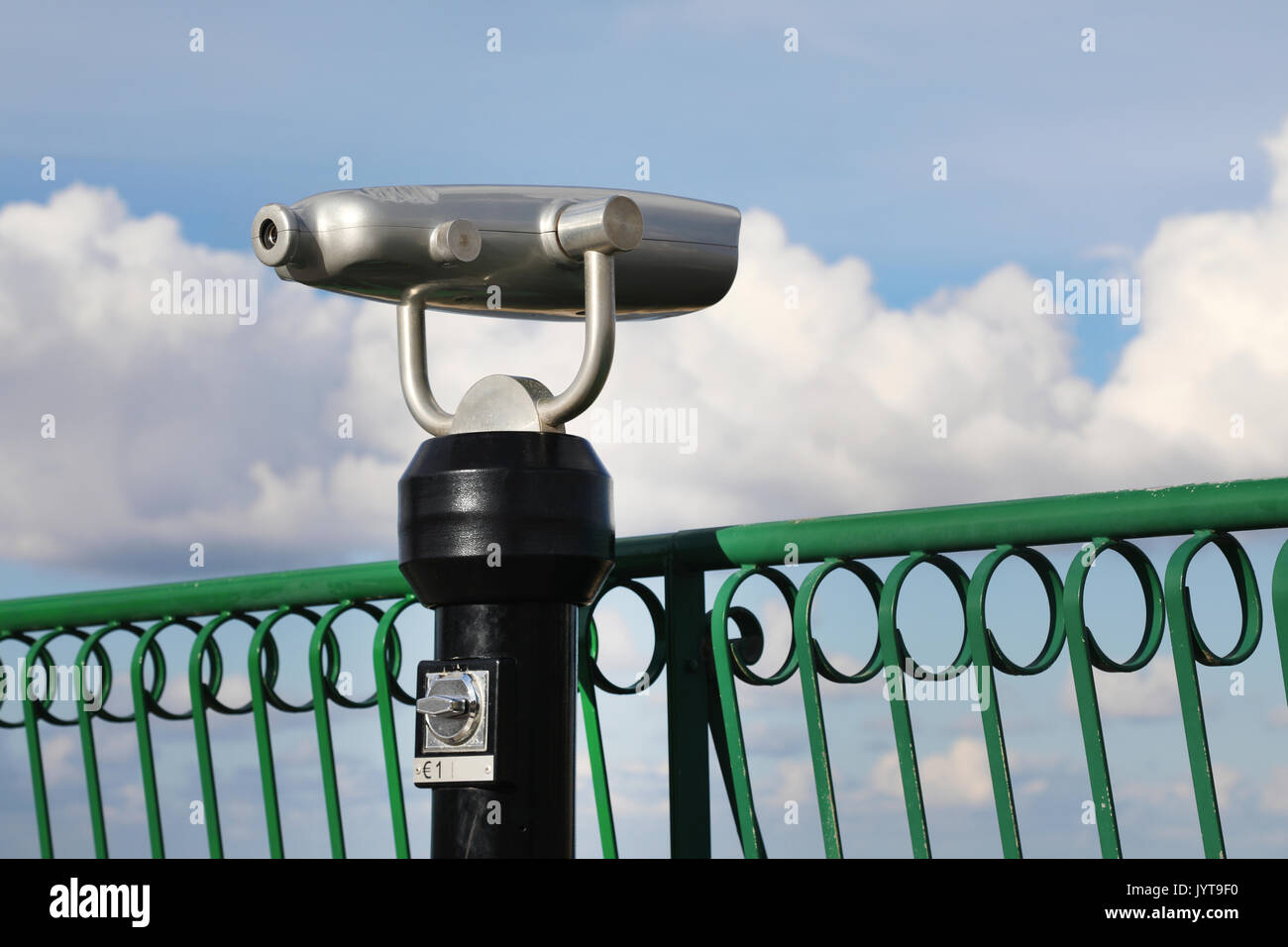 Coin-operated spy viewing machine against cloudy sky Stock Photo - Alamy
