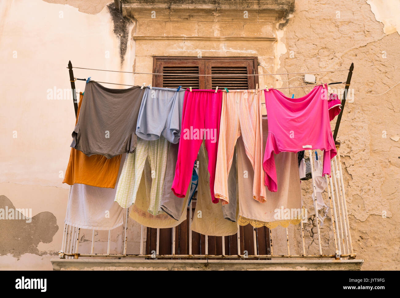 Balcony with colourful washing drying on Ortigia Island, Syracuse ...