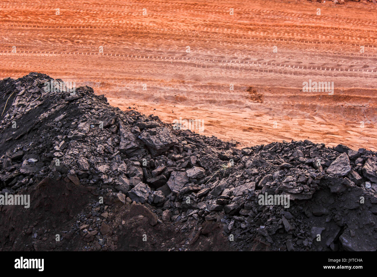charcoal waste and brick colored ground Stock Photo - Alamy