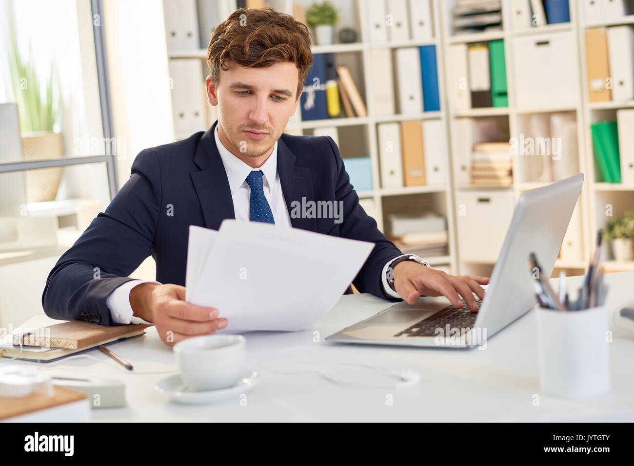 Successful businessman documents in hi-res stock photography and images ...