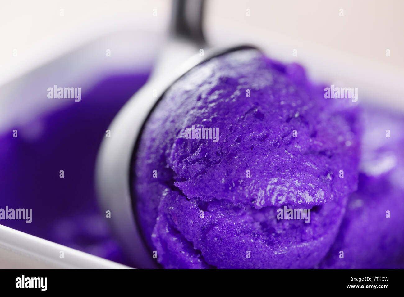 scooping purple ice cream close up Stock Photo - Alamy