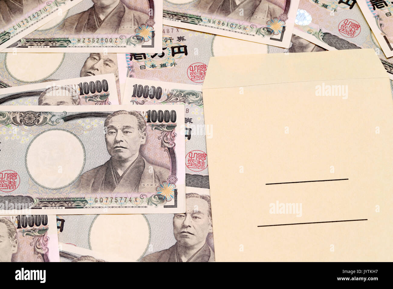 Japanese money and salary envelope on white background Stock Photo - Alamy