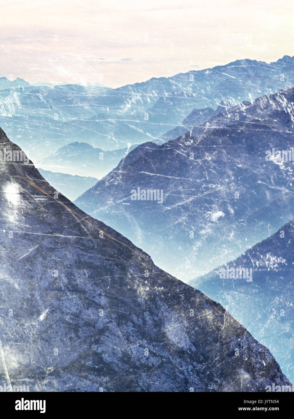 Film grain effect. Film scratch. View over high sharp mountain peaks ...