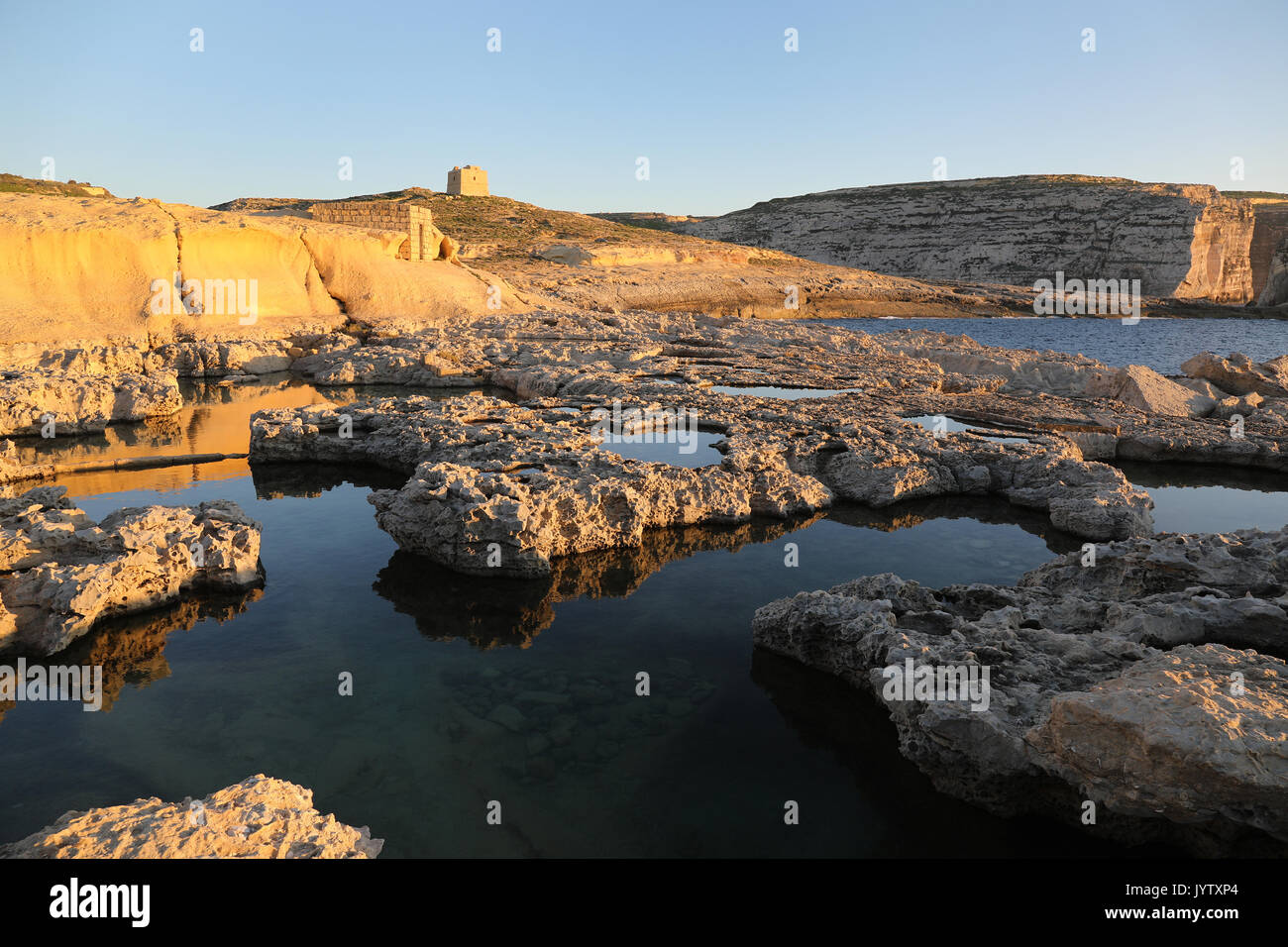 Maltese coastline with cliffs and old watch tower Stock Photo - Alamy