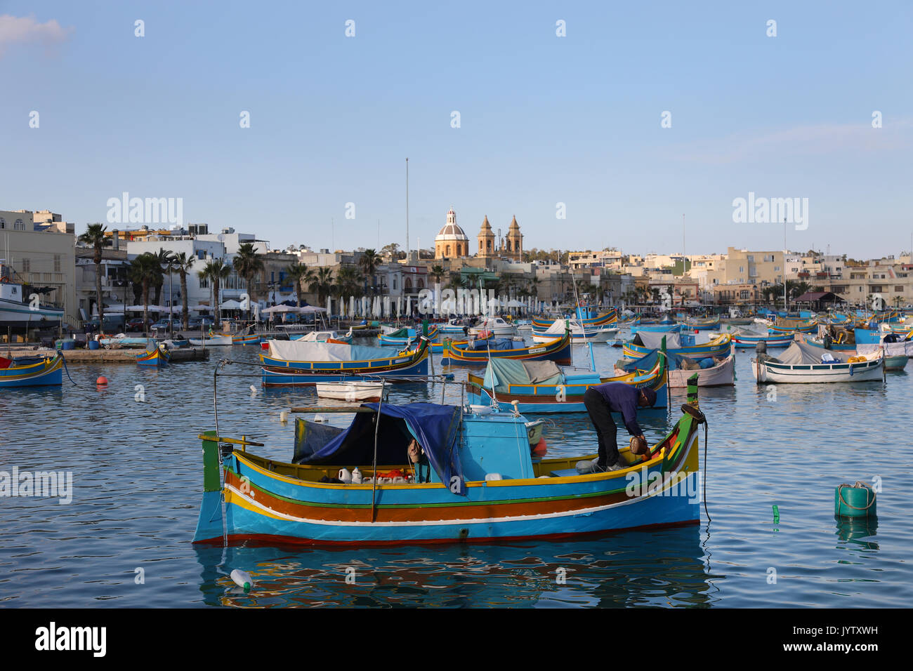 Traditional colorful fishing boats Luzzu moored at Marsaxlokk ...