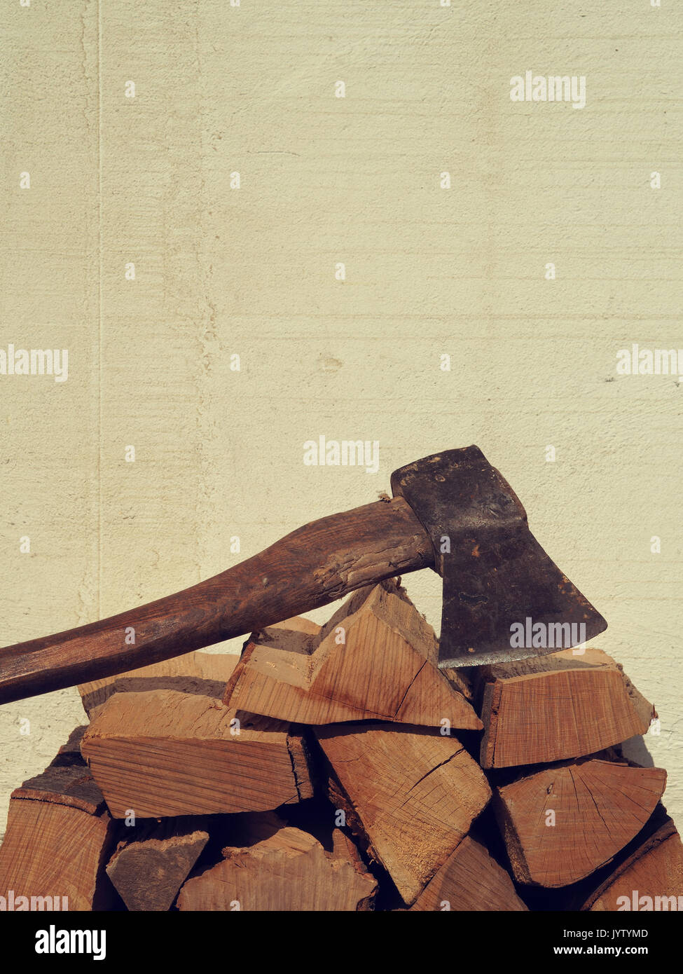 Pile of beech fire wood with an old axe, alternative energy Stock Photo ...