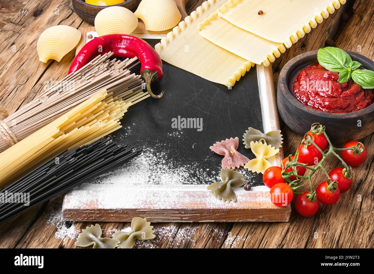 Various types of Italian pasta on rustic background Stock Photo - Alamy