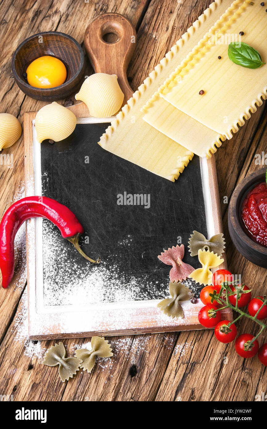 Various types of Italian pasta on rustic background Stock Photo - Alamy