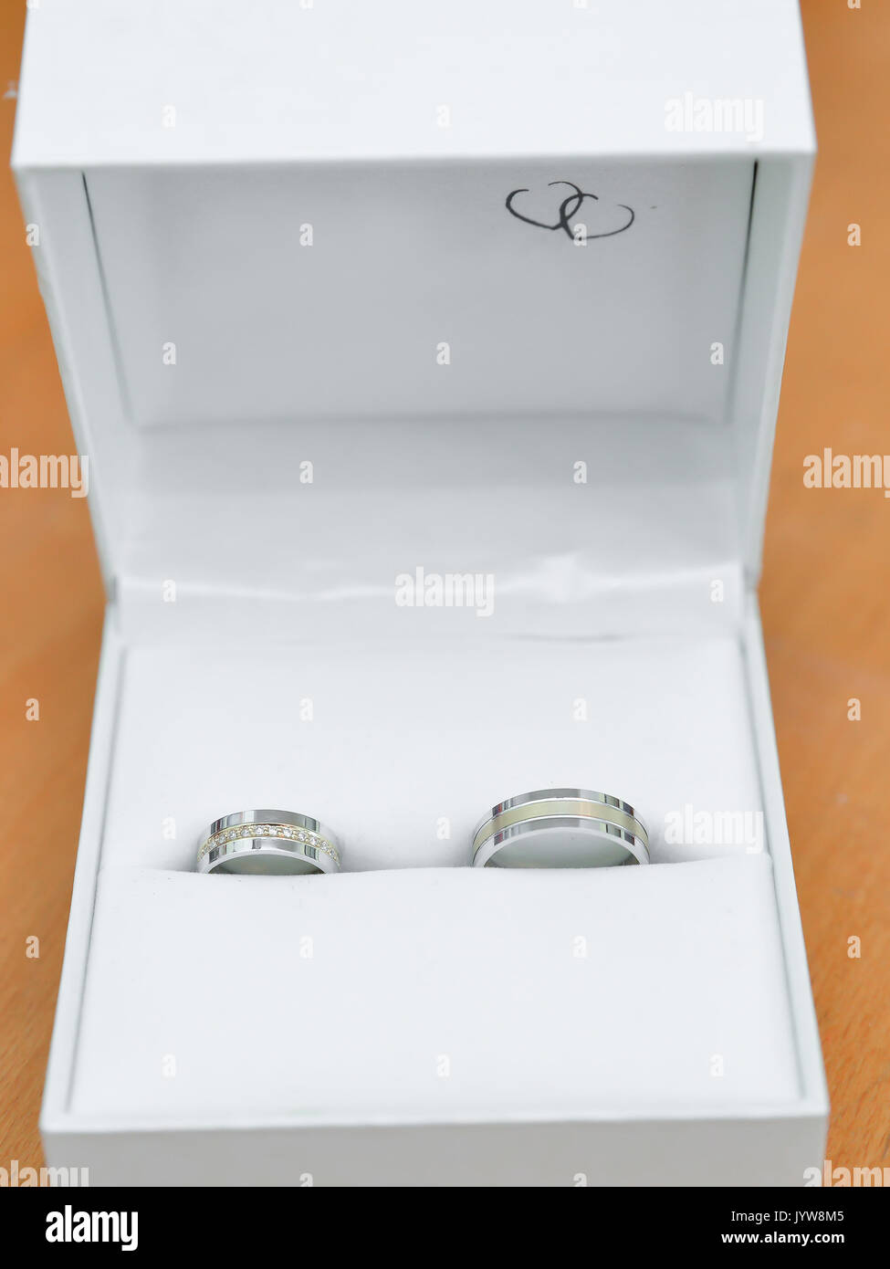 wedding rings in a white box Stock Photo - Alamy