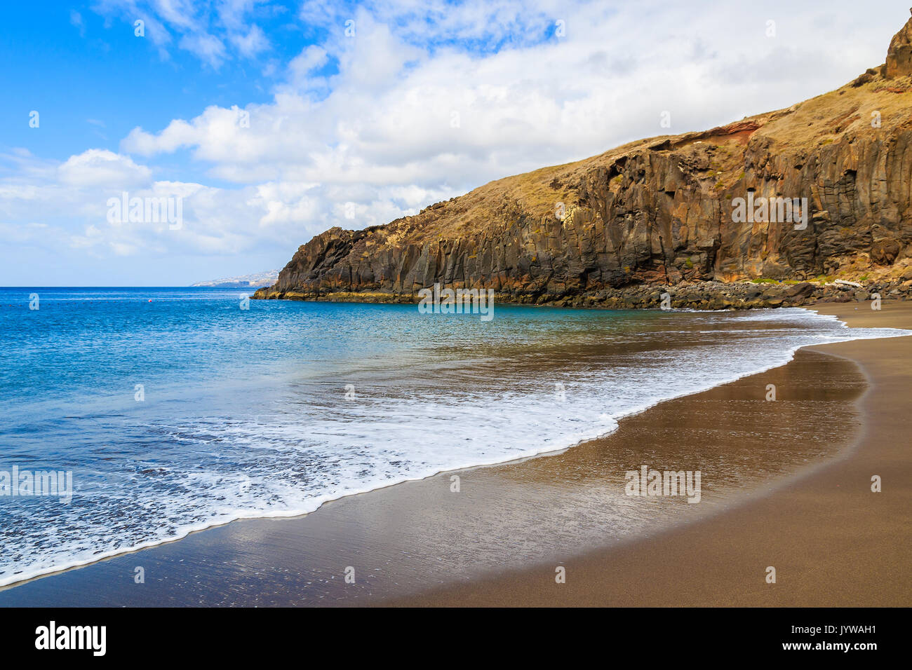 Ocean wave on beautiful Prainha beach with golden sand, Madeira island ...