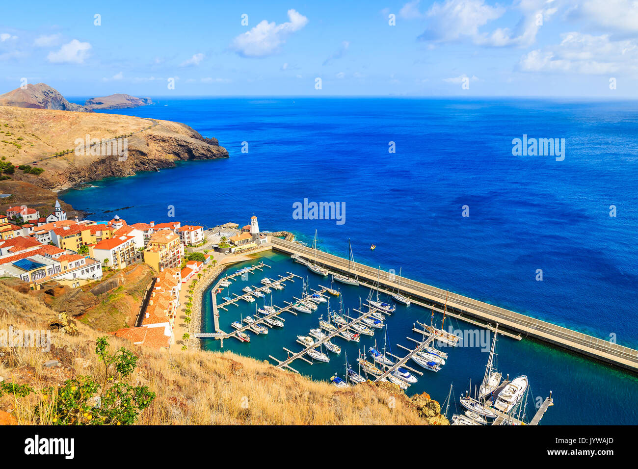 View of sailing port with yacht boats and colourful houses near Canical ...