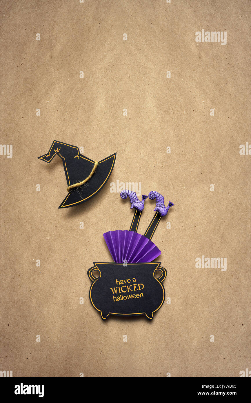 Creative halloween concept photo of witch in a boiler made of paper on ...
