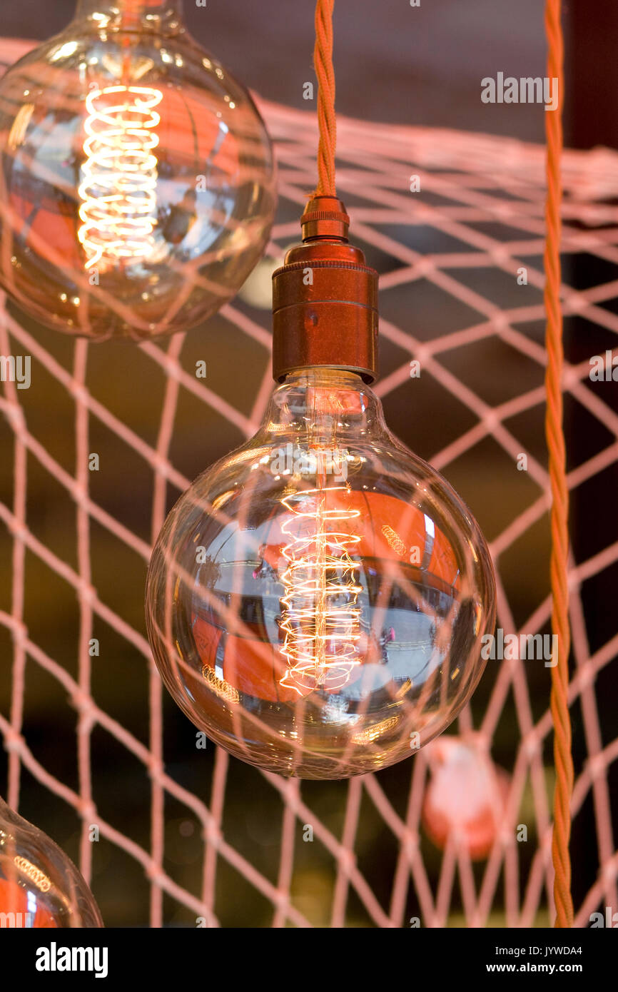 Close up glowing vintage light bulb showing inner filament Stock Photo ...