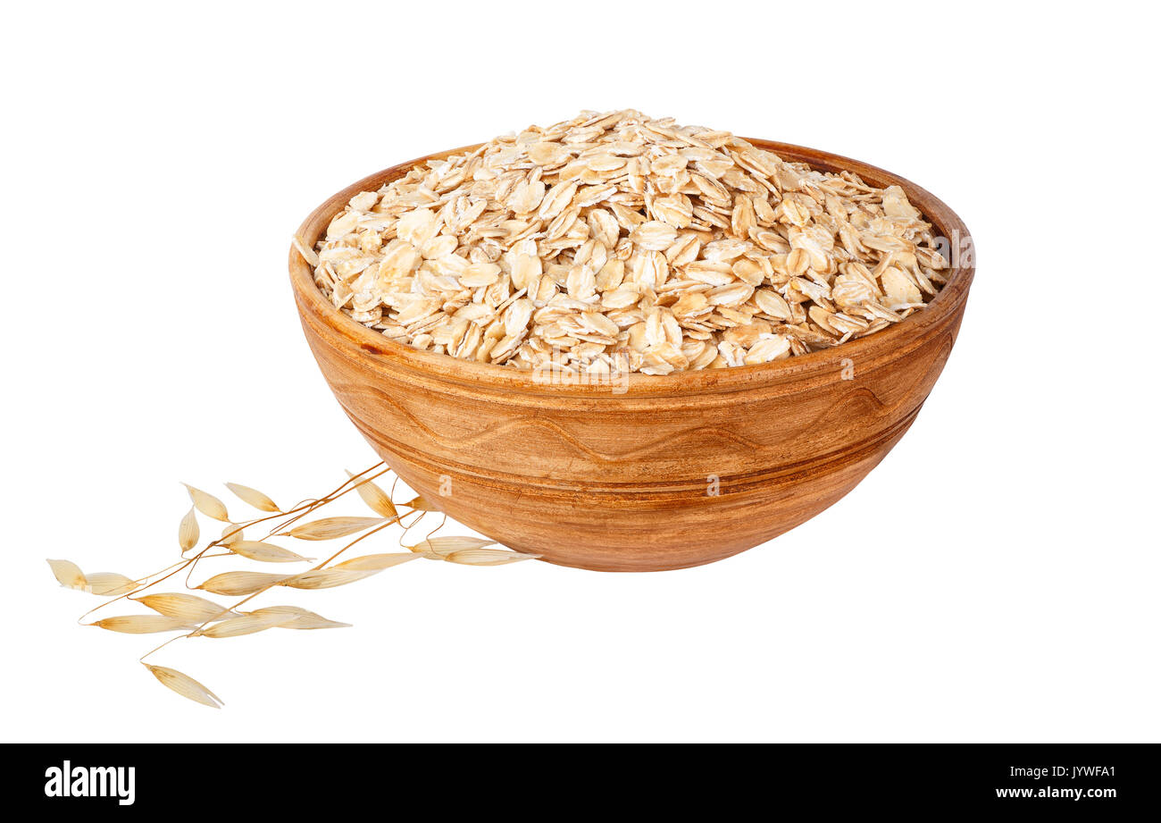 oat flakes in bowl and ripe oat ears isolated on white background ...