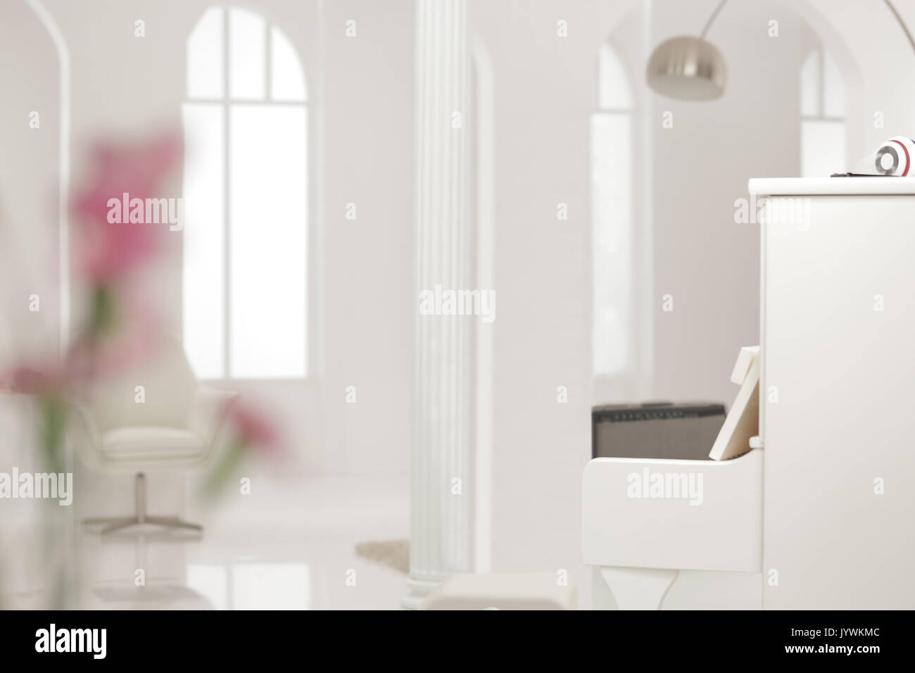 a white piano put in the white lobby lounge Stock Photo - Alamy