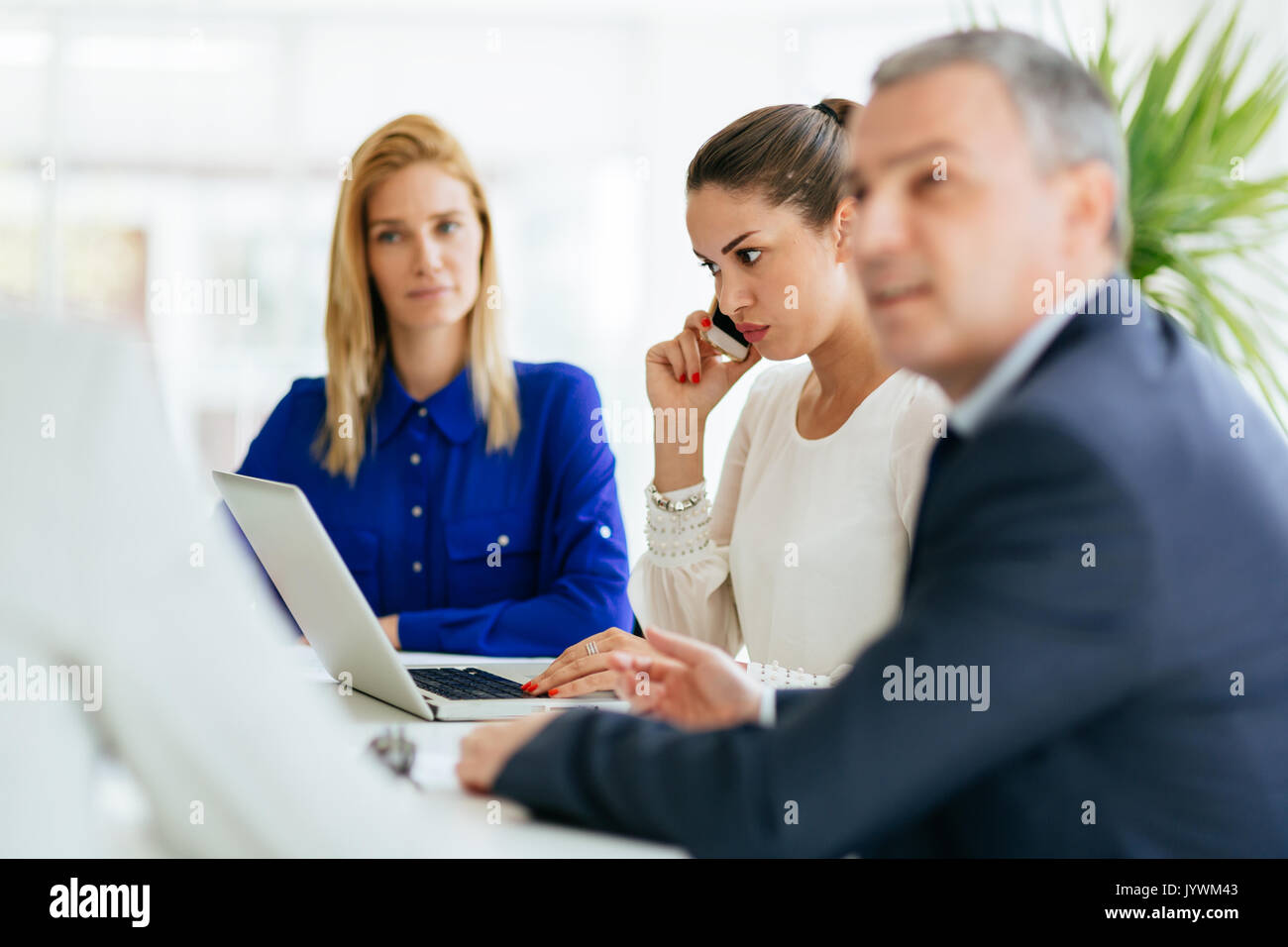 Business people using devices Stock Photo - Alamy