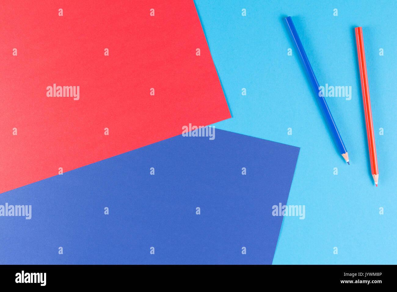 Colorful paper with red and blue pencils Stock Photo - Alamy