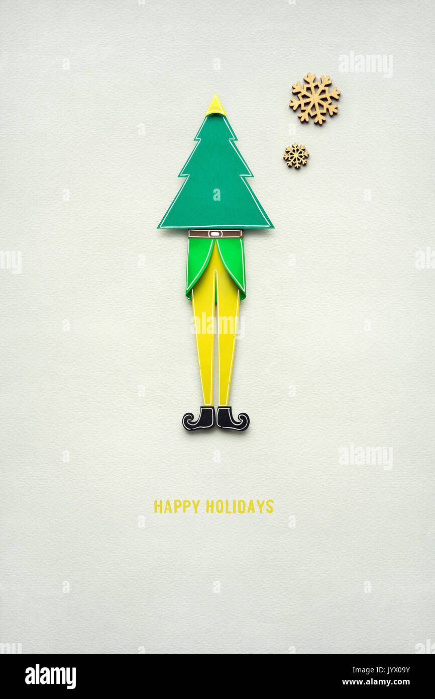 Creative concept photo of an elf made of paper on grey background Stock ...