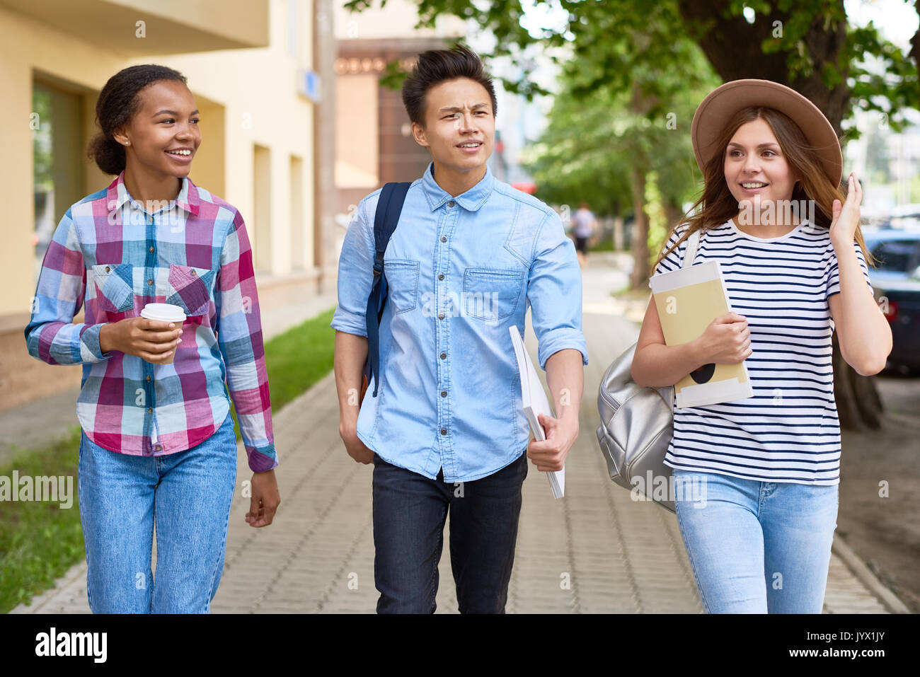 Three Students Going to School Stock Photo - Alamy