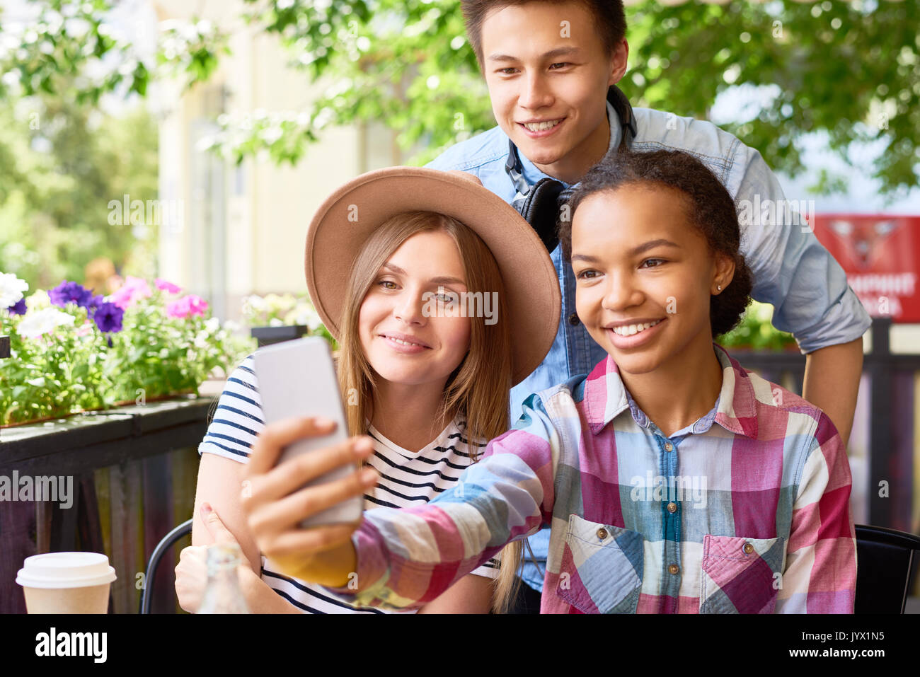 Teenage Friends Taking Selfie in Cafe Stock Photo - Alamy