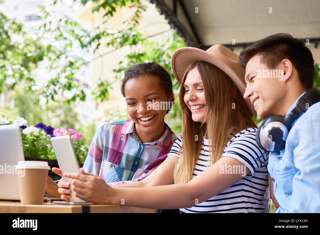 Young People Using Computers in Cafe Stock Photo - Alamy