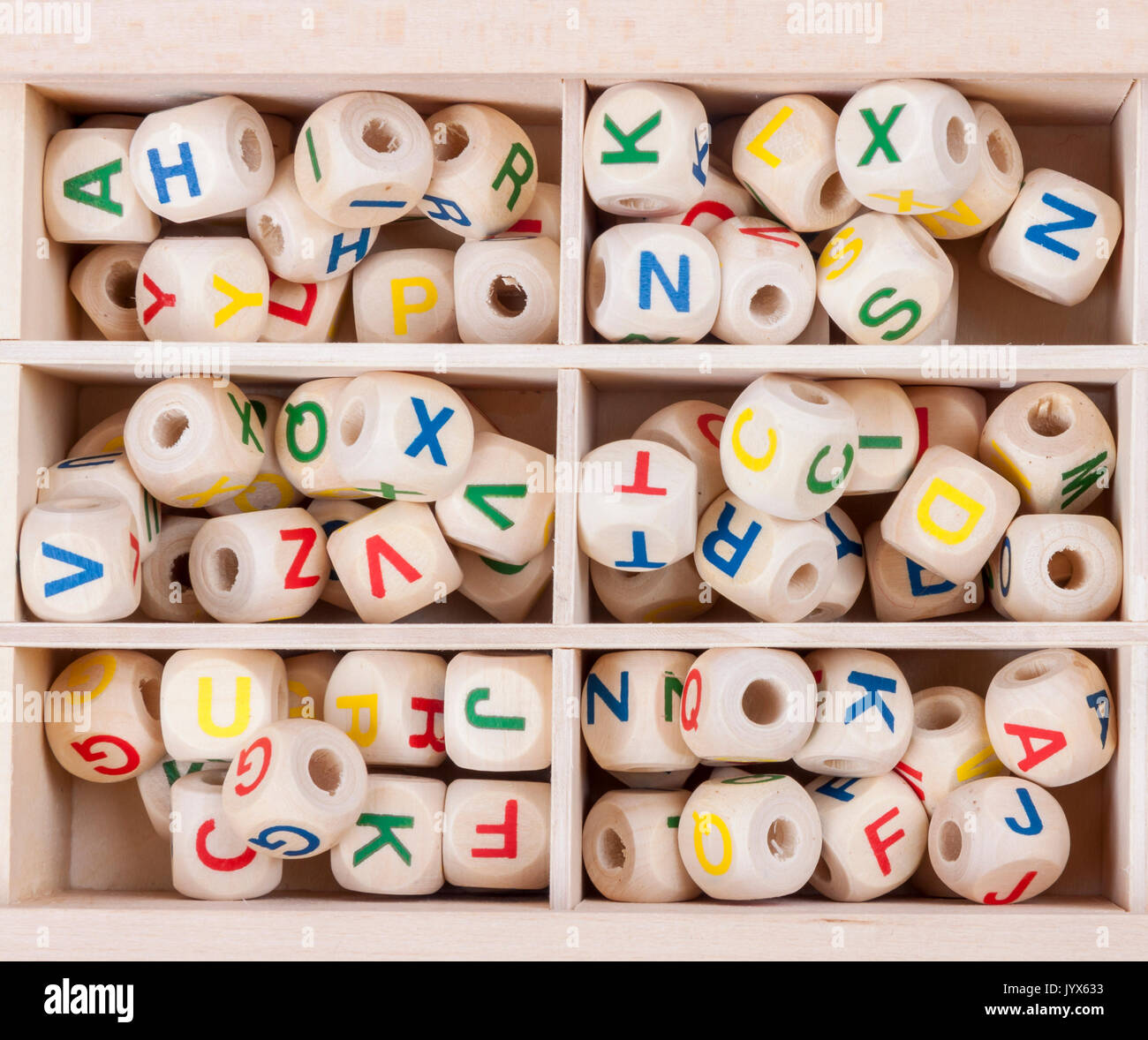 Wooden letters in the box - creative game Stock Photo - Alamy